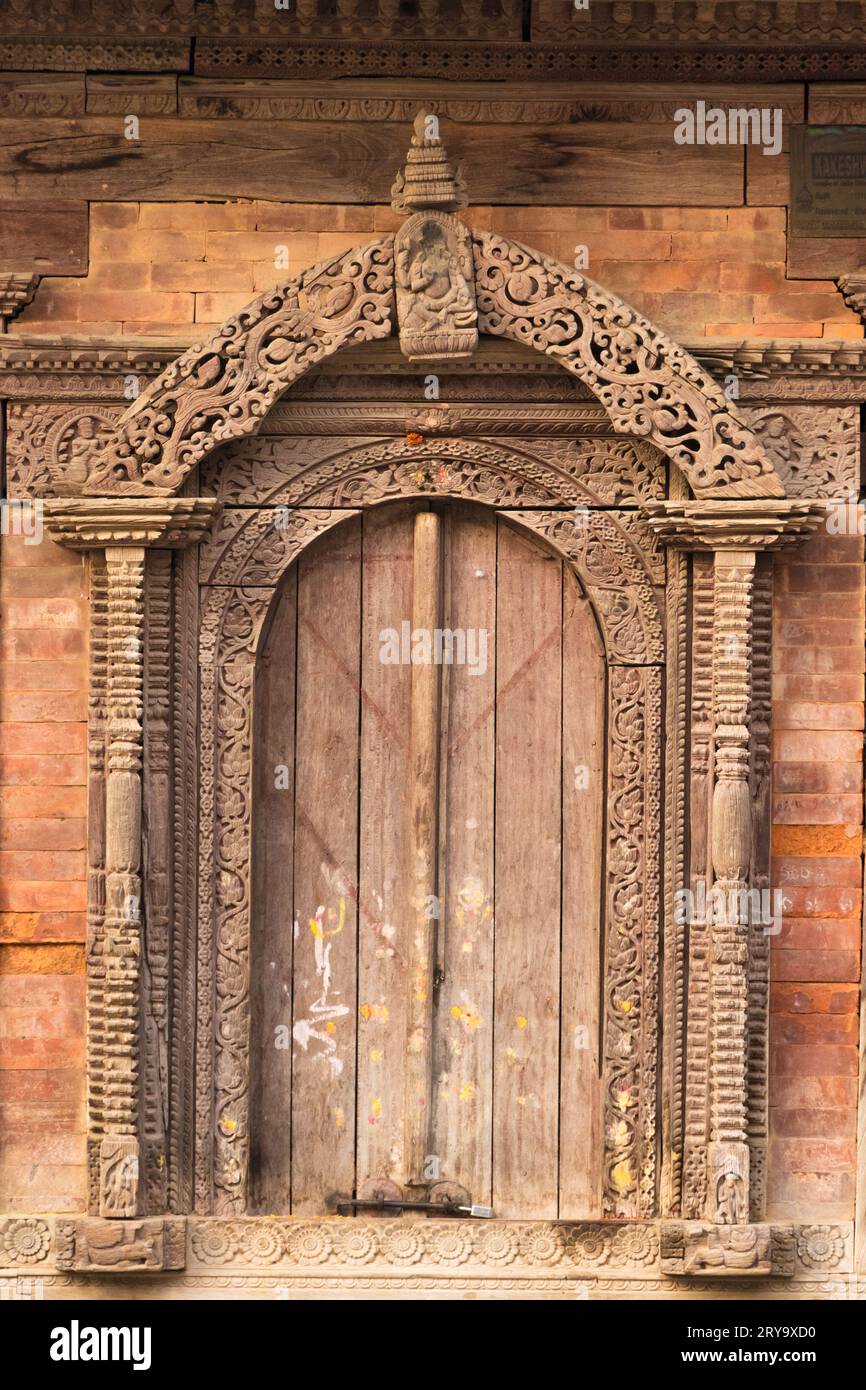 Carved wooden door details of one of the temple located at Hanuman ...