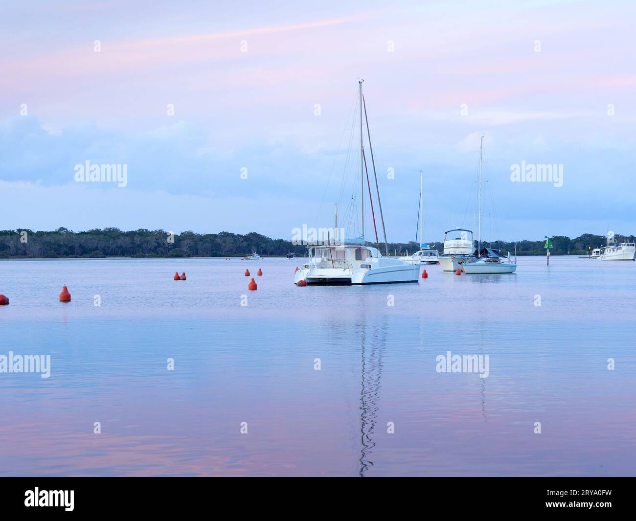 Tin Can Bay Queensland Australia with a reverse sunset over the bay and ...