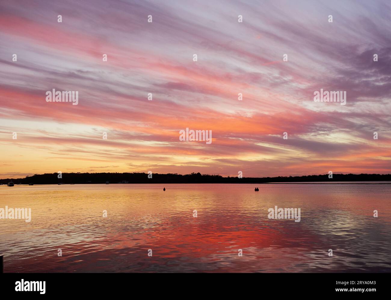 Sunset over the bay at Tin Can Bay Queensland Australia. Lovely, pinks ...