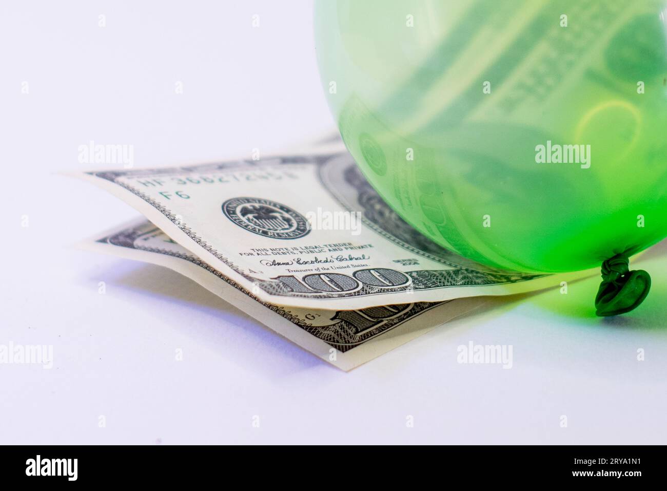 Conceptual image of dollars with a balloon representing inflation Stock ...