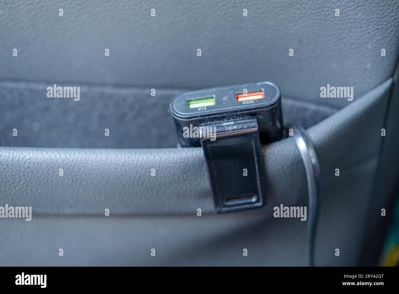 Power bank with charging cable plugged in Store in the back seat pocket ...