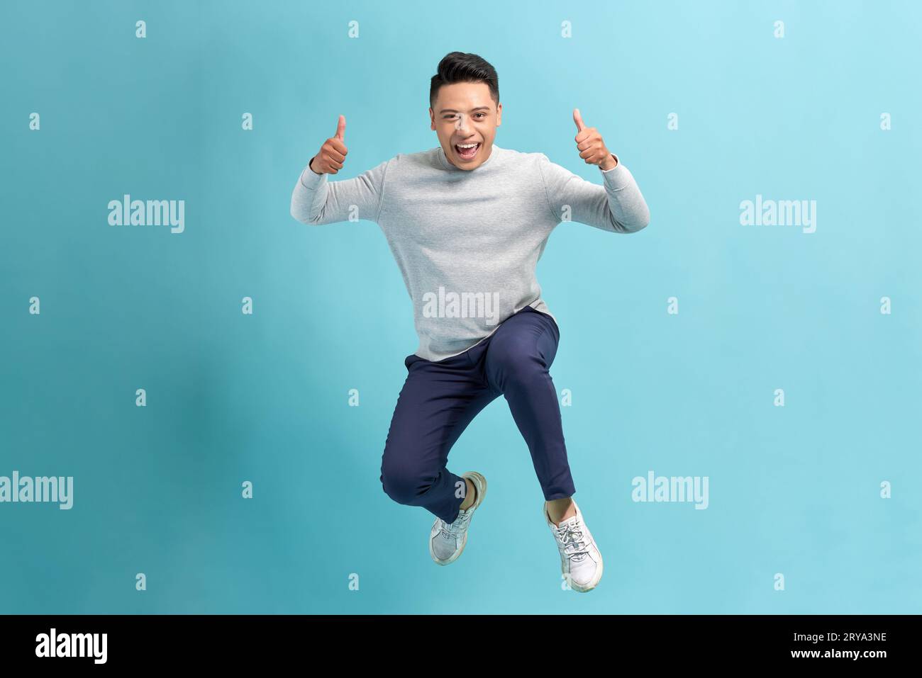Full length photo of confident pretty man jumping high thumbs up empty ...
