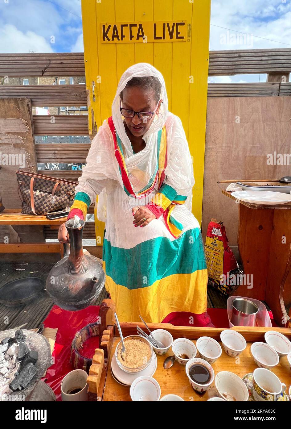 Emebyt Demke, 51, sets down a jebena, or Ethiopian clay coffee pot ...