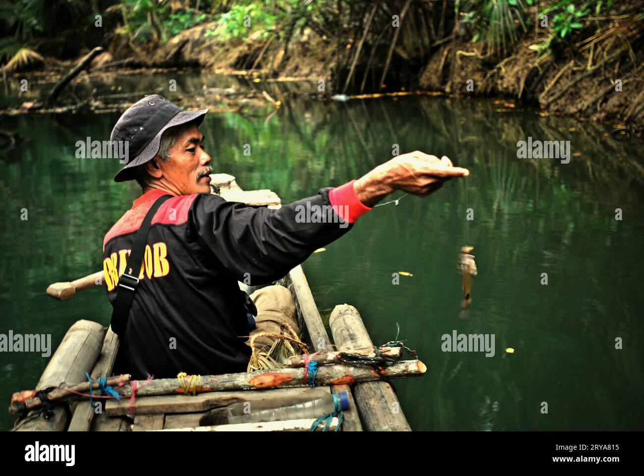 A national park ranger is photographed while fishing from a boat on ...