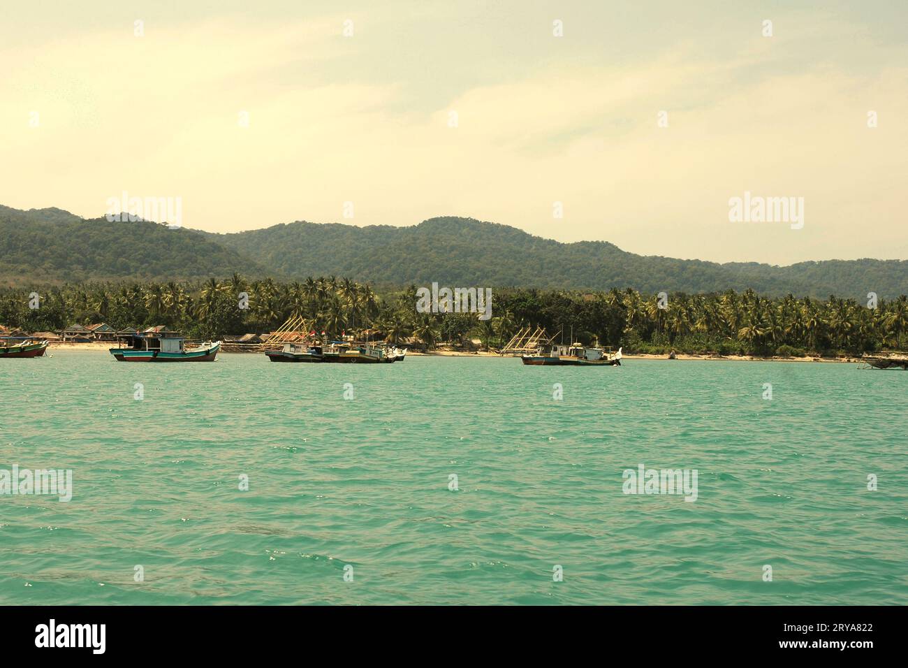 A view of the coastal landscape of Sumur, a town that is a part of the ...