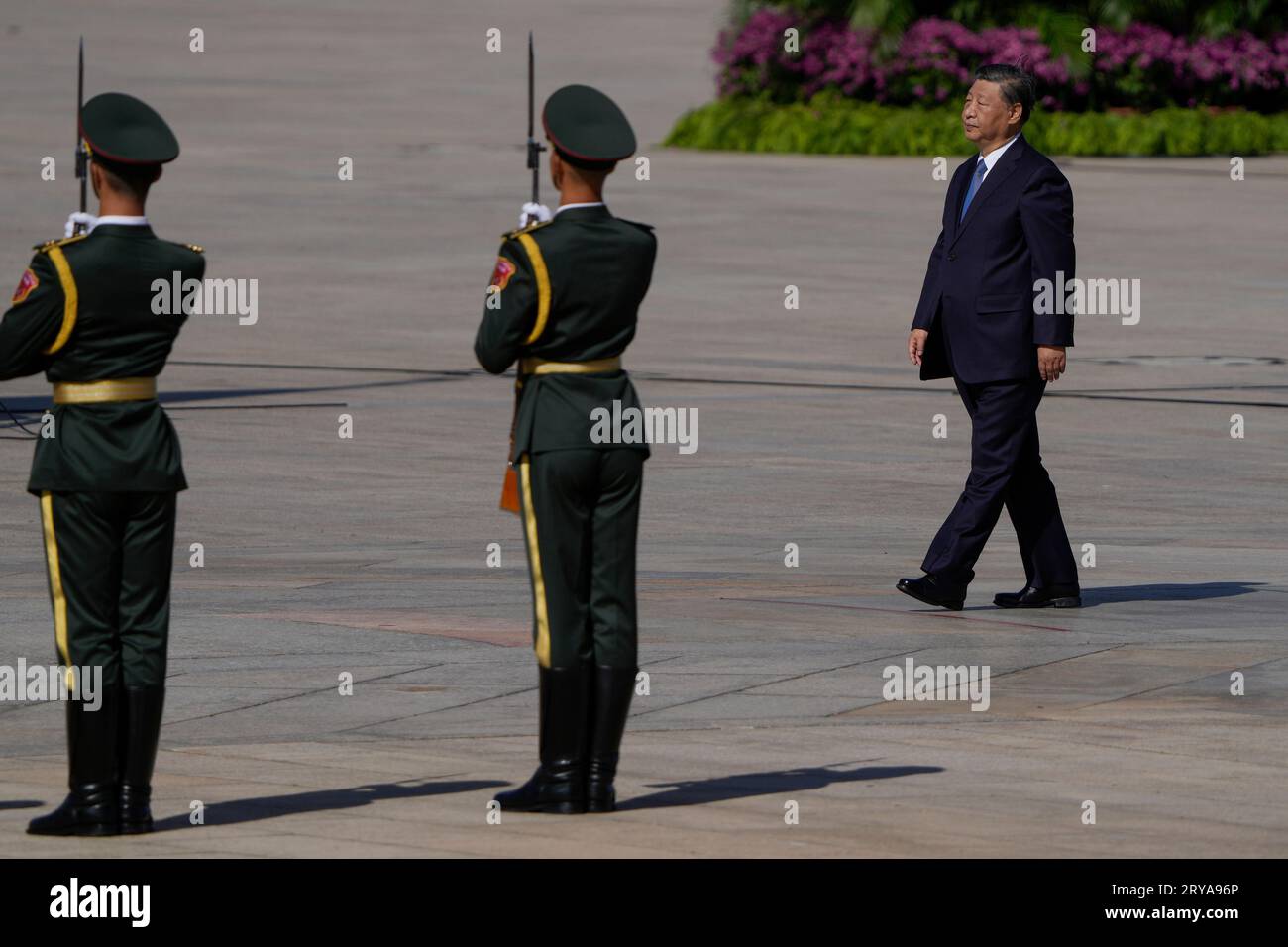 Chinese President Xi Jinping, right, walks toward to the Monument to ...