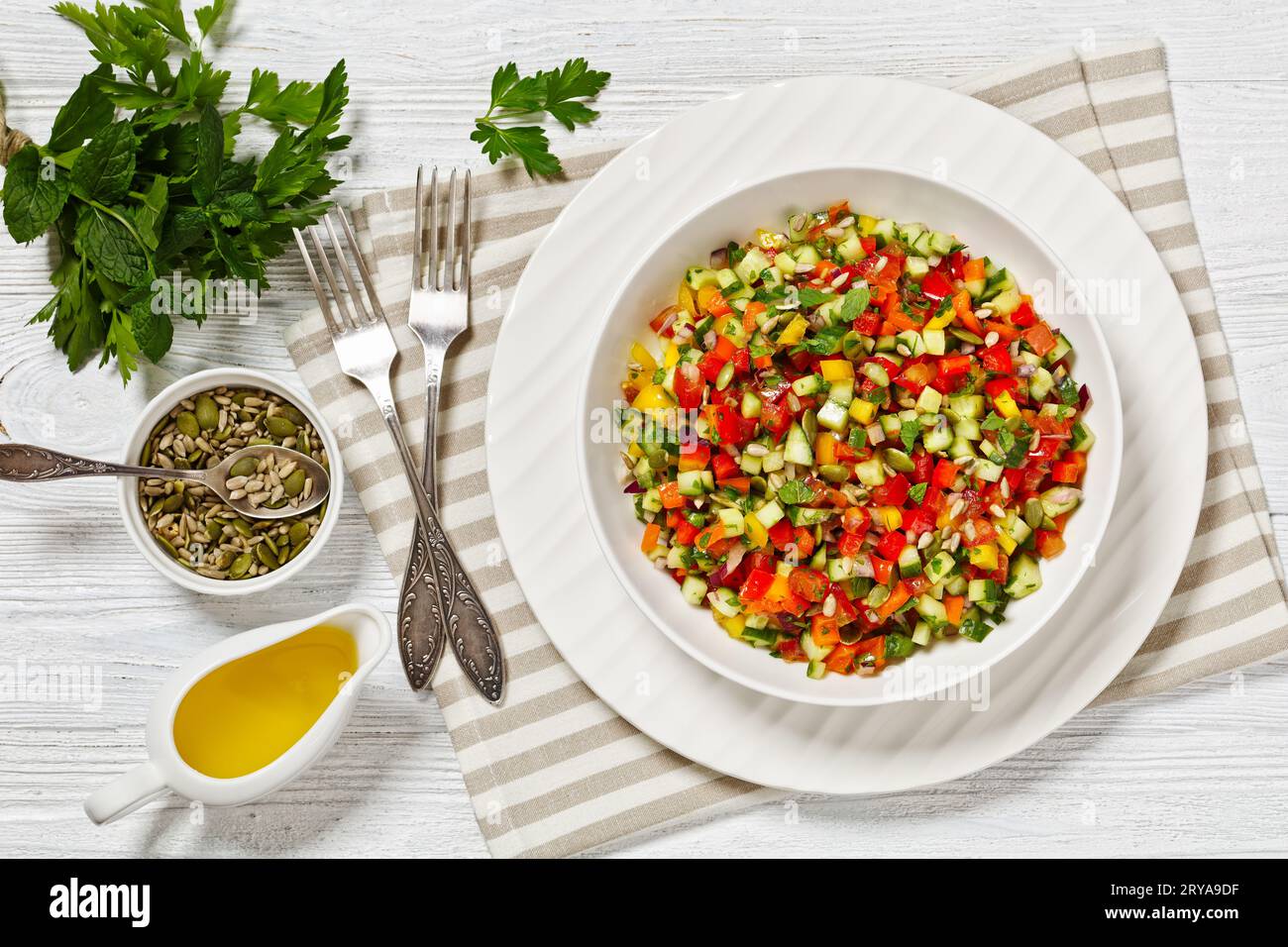 Israeli salad of finely diced tomato, onion, cucumber, and bell peppers ...