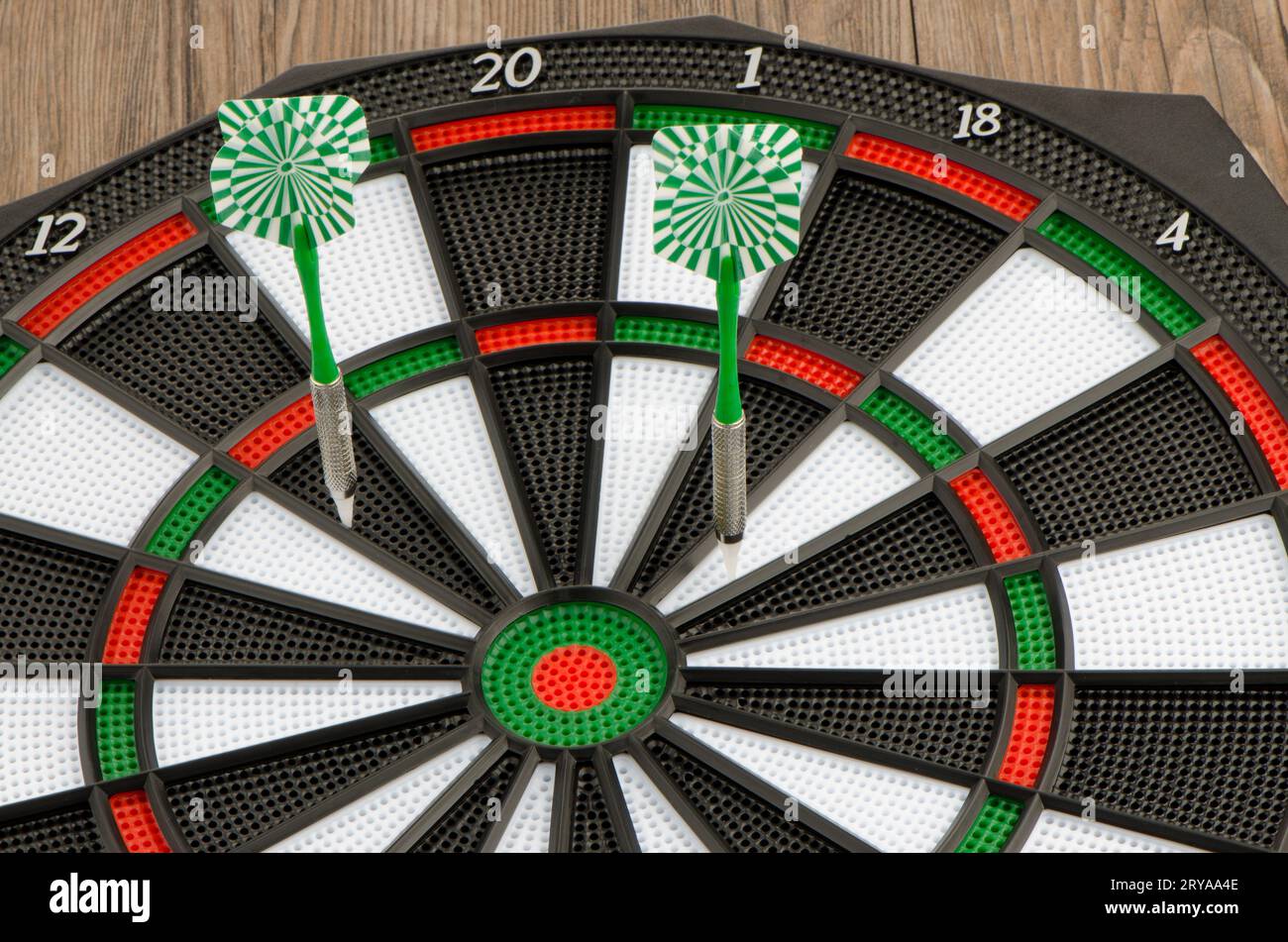 Dart board with darts Stock Photo - Alamy