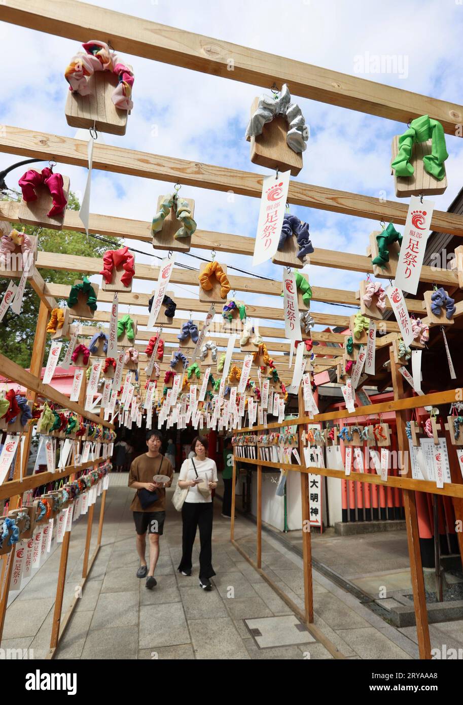 Geta, traditional Japanese footwear, with strips of paper with wishes ...