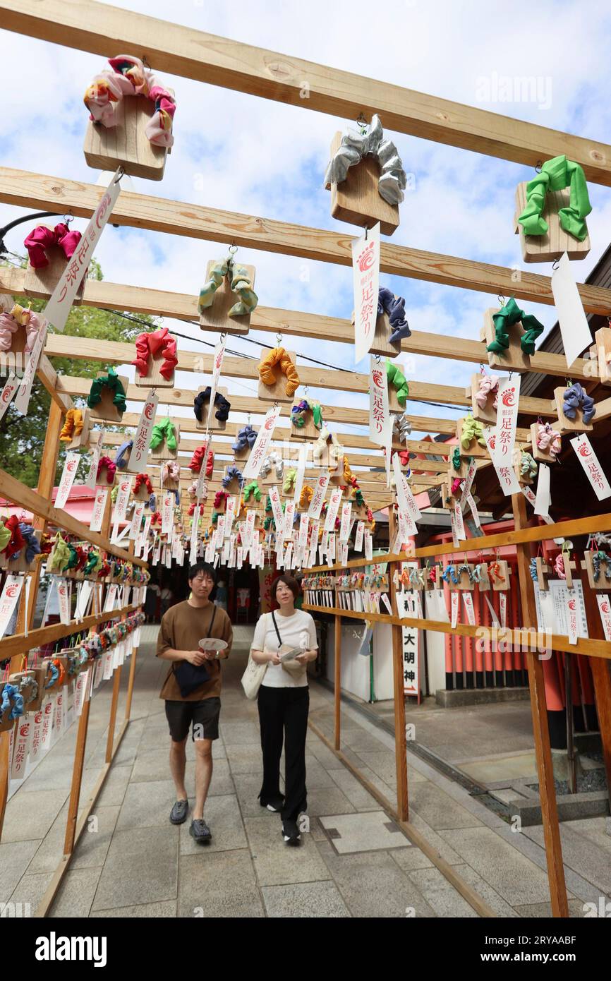 Geta, traditional Japanese footwear, with strips of paper with wishes ...