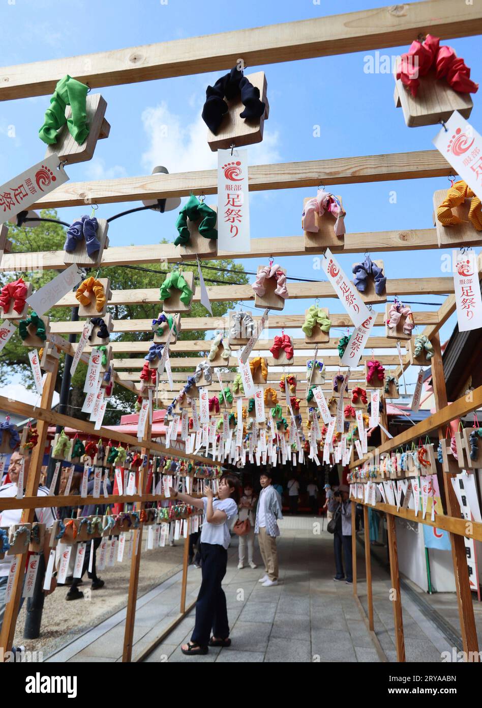 Geta, traditional Japanese footwear, with strips of paper with wishes ...
