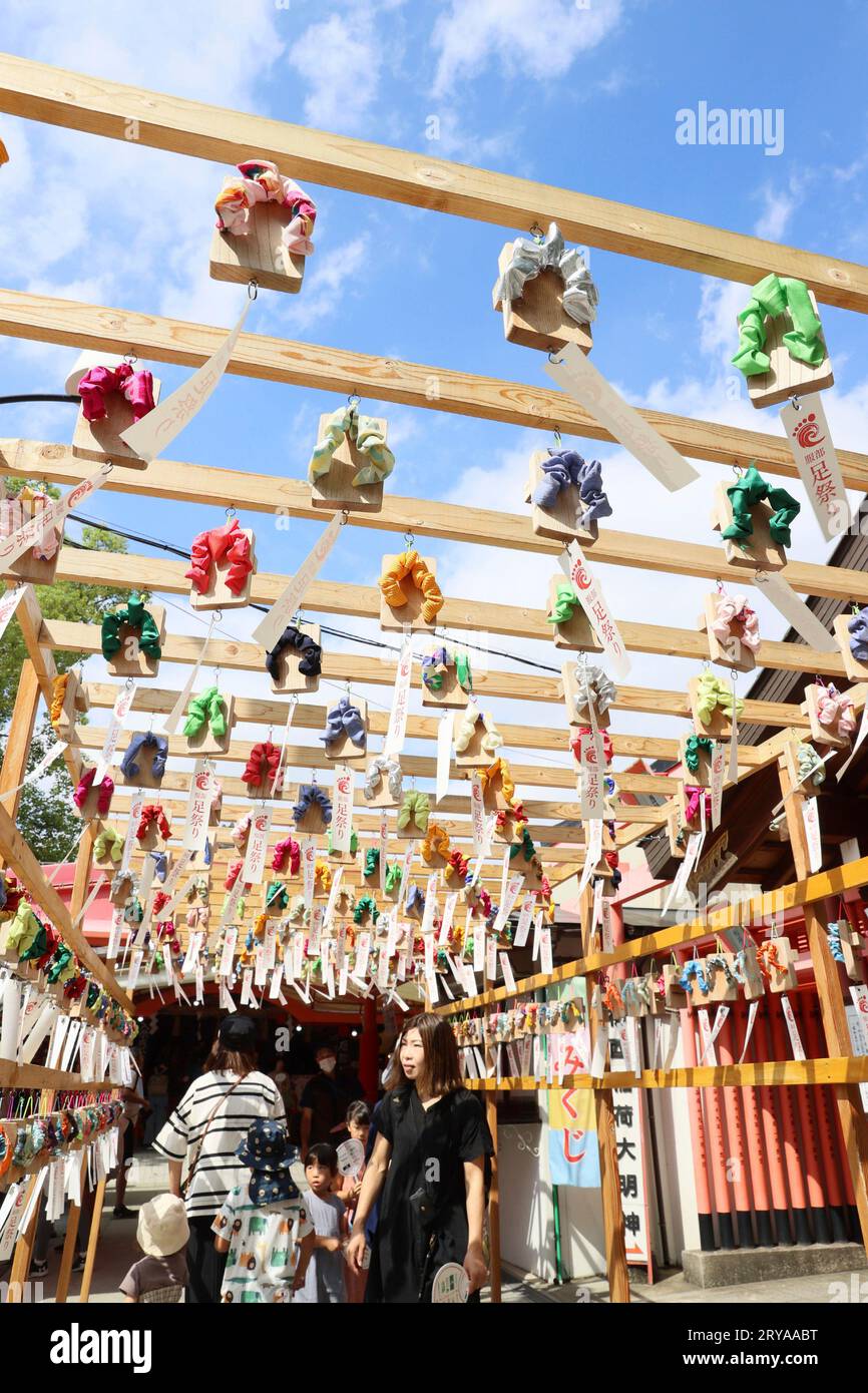 Geta, traditional Japanese footwear, with strips of paper with wishes ...