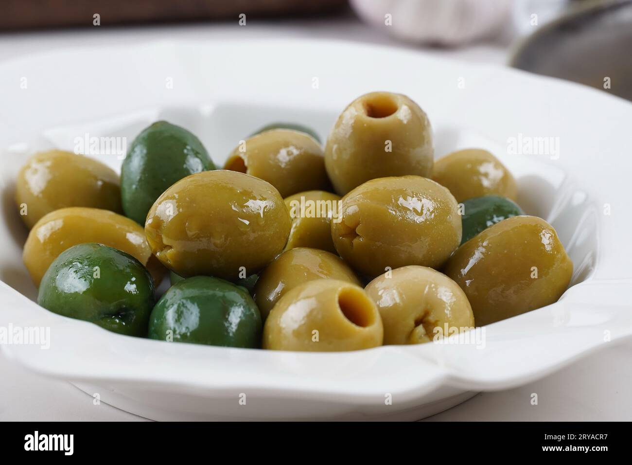 Colorful Olives in white plate ready for dinner Stock Photo - Alamy
