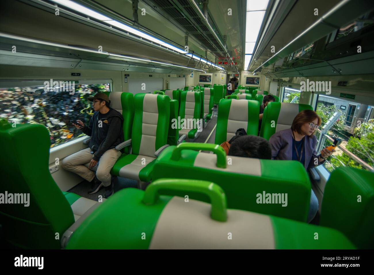 FEEDER TRAIN TEST RUN Passengers in a feeder train during a test run in ...