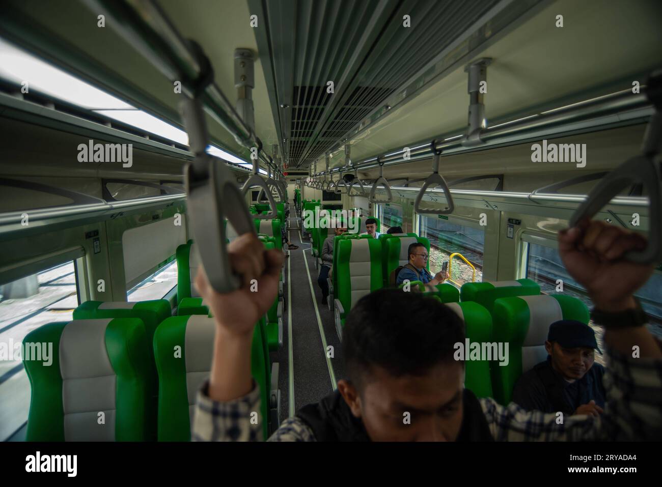 FEEDER TRAIN TEST RUN Passengers in a feeder train during a test run in ...