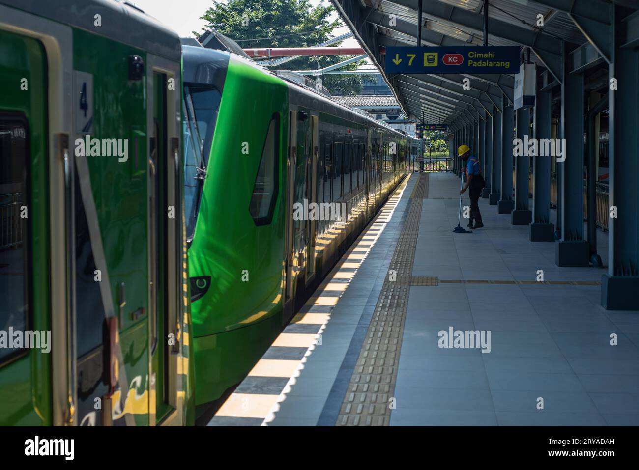FEEDER TRAIN TEST RUN Officers clean the platform of a feeder train on ...