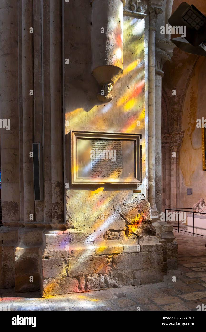 Coloured light shining on a pillar in Eglise Saint Nicholas, Blois ...