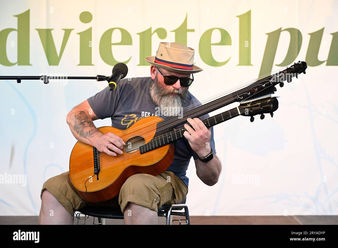 Vienna, Austria. September 28, 2023. Viennese song musician with double ...