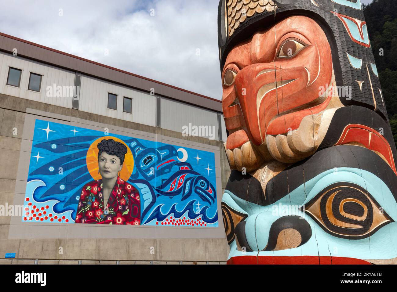 The Kaagwaantaan pole with the Elizabeth Peratrovich mural (by Crystal ...
