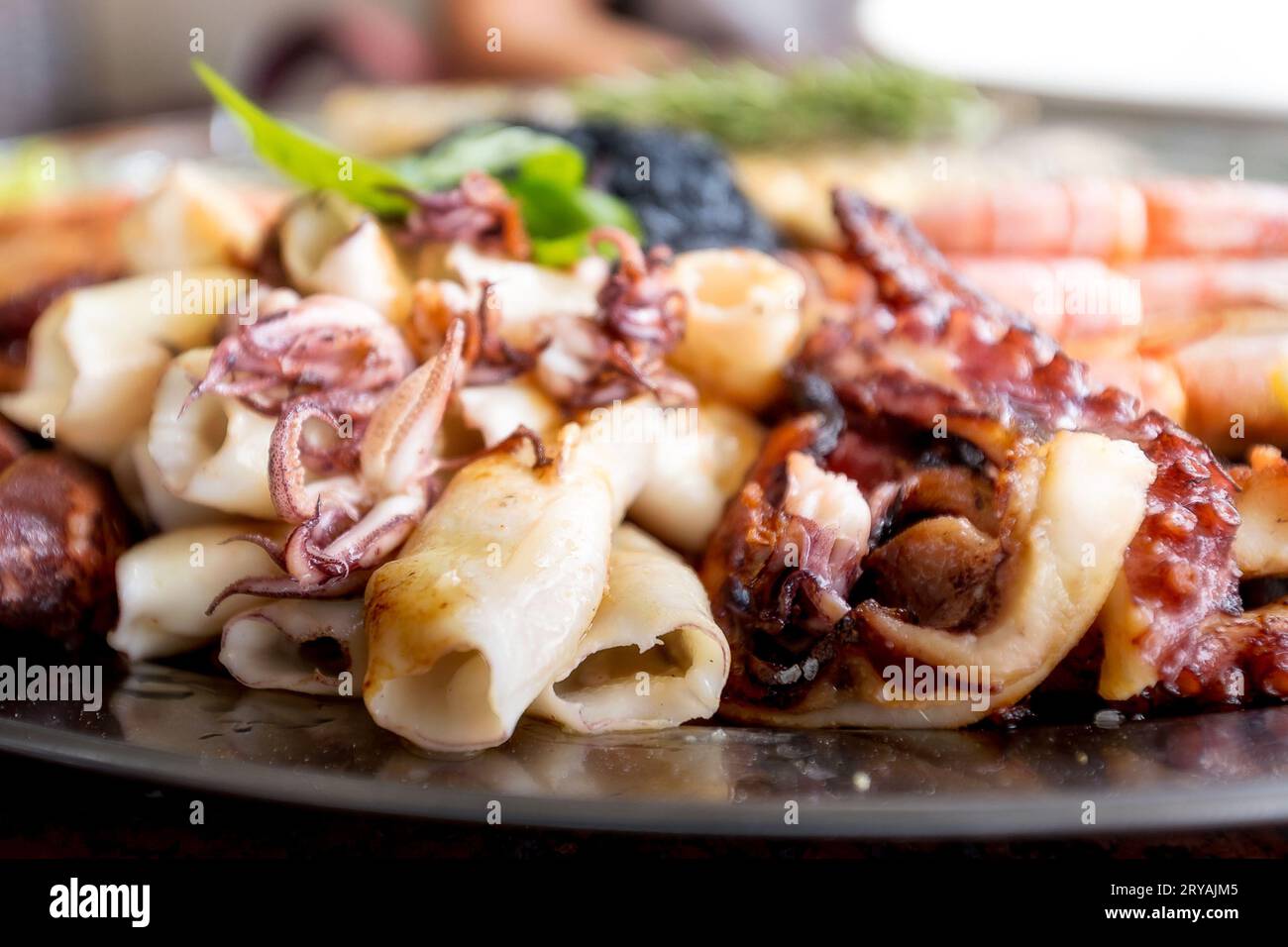 Roasted Mixed Seafood plate with Calamari Squids, prawns and Grilled octopus, Mediterranean ...