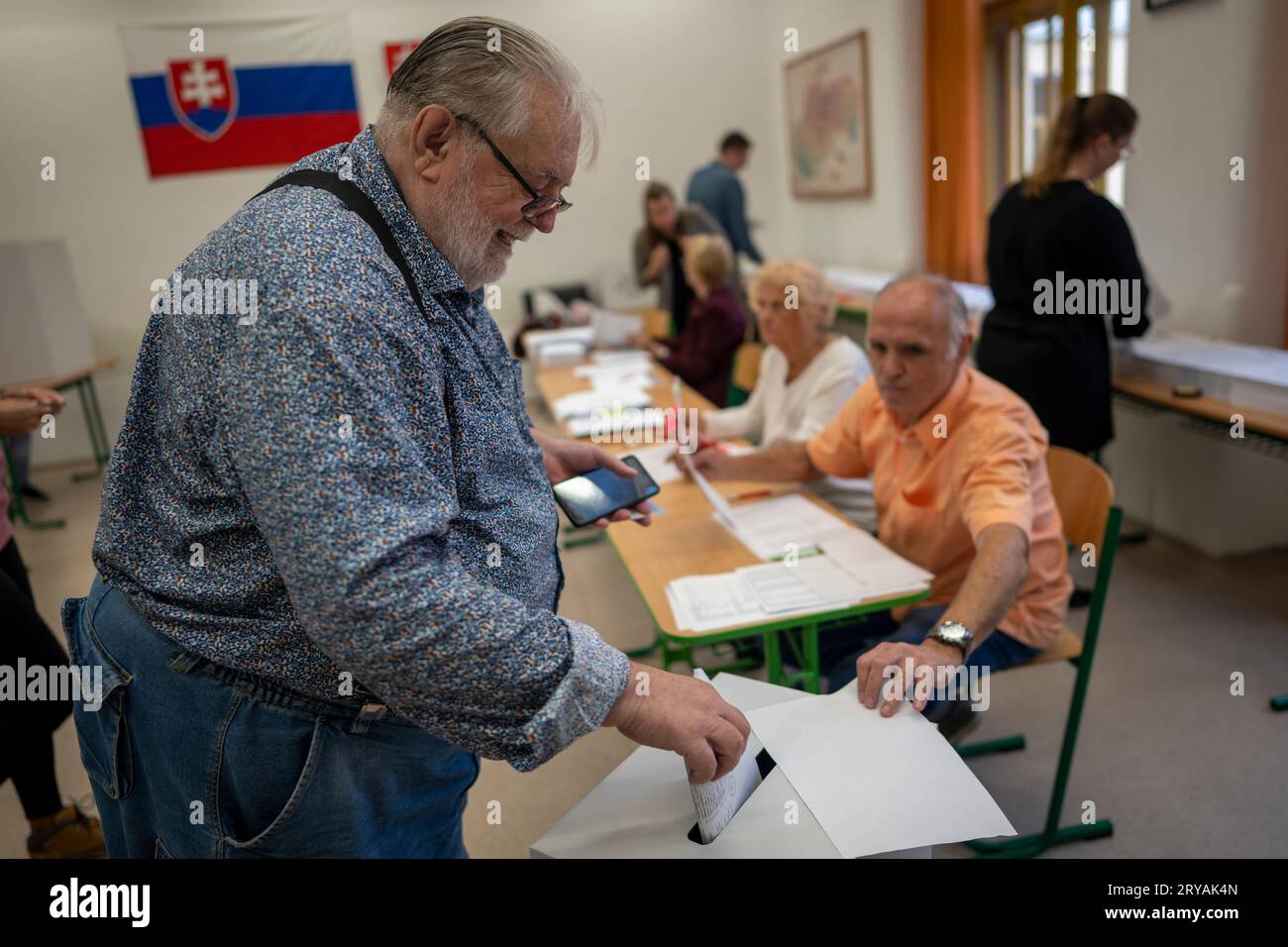 A voter casts his ballot at a polling station in Bratislava, Slovakia ...