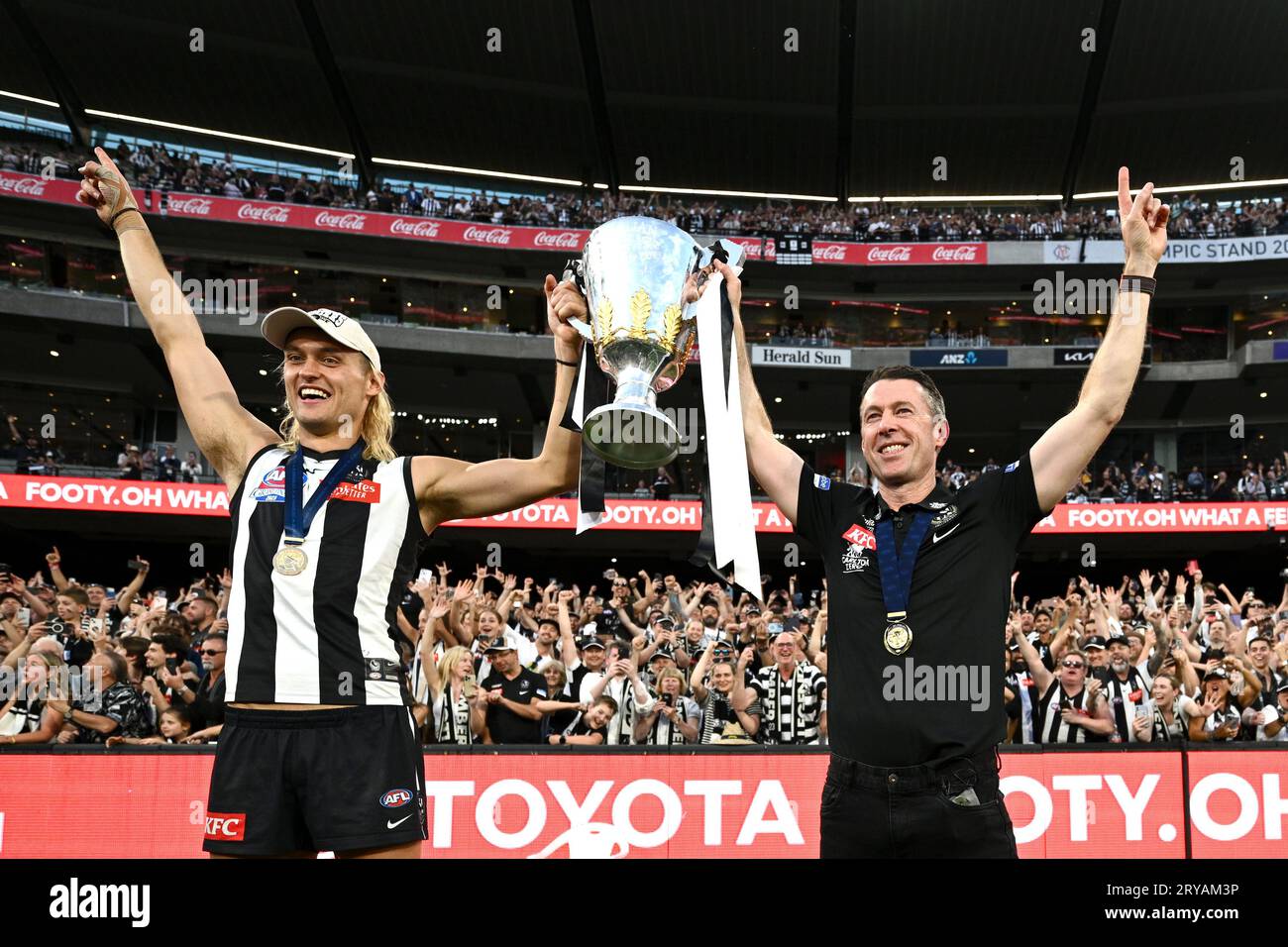 Melbourne, Australia. 30th Sep, 2023. Darcy Moore of Collingwood (left) and Collingwood Magpies ...