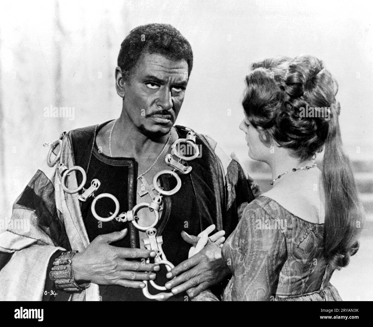 LAURENCE OLIVIER and MAGGIE SMITH in OTHELLO (1965), directed by STUART BURGE. Credit: BR HOME ...