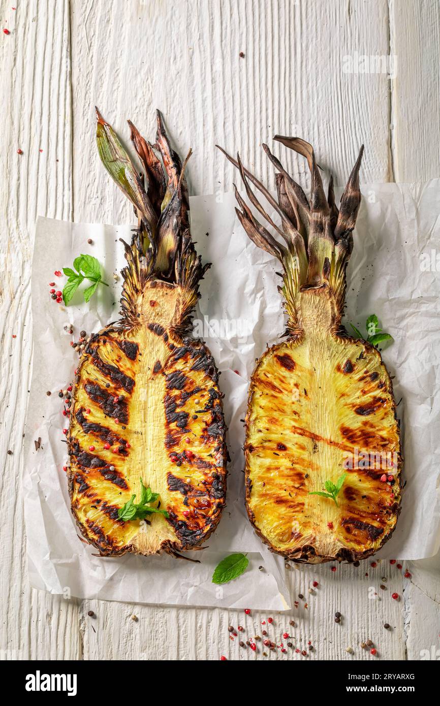 Roasted pineapple with mint and red pepper. Roasted pineapple on grill ...