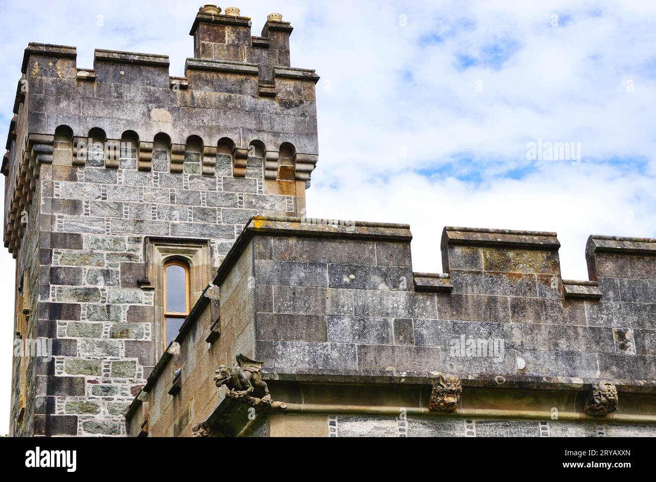 Looking up at the stone battlements of Lews Castle, a mock-Tudor castle ...