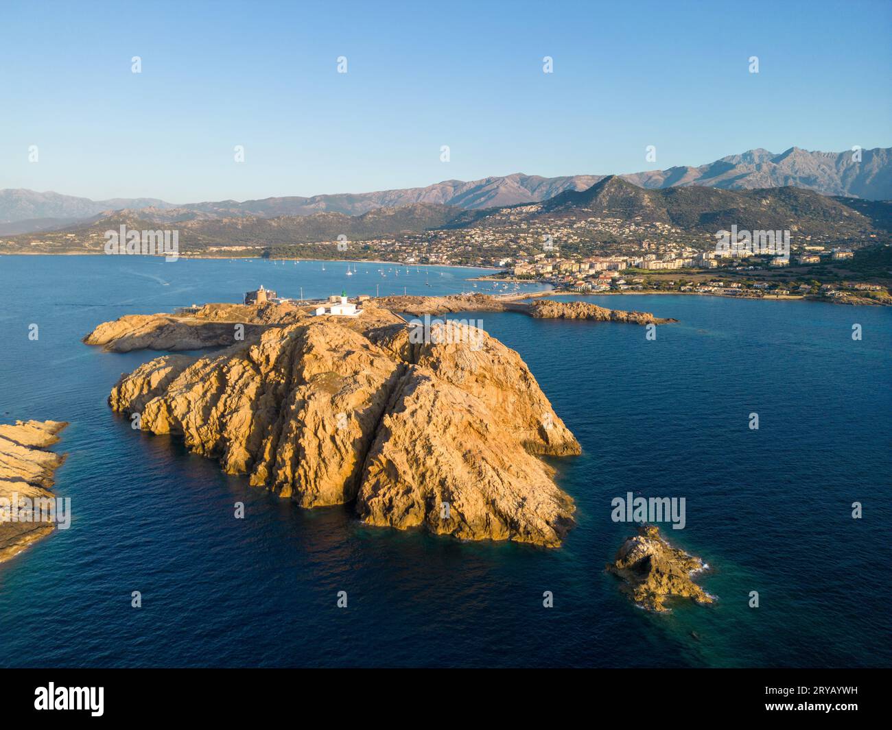 Aerial view of La Pietra lighthouse and island at Ile Rousse in Corsica ...