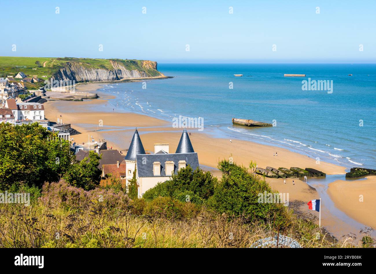 View over Arromanches beach in Normandy on a sunny day with remains of ...