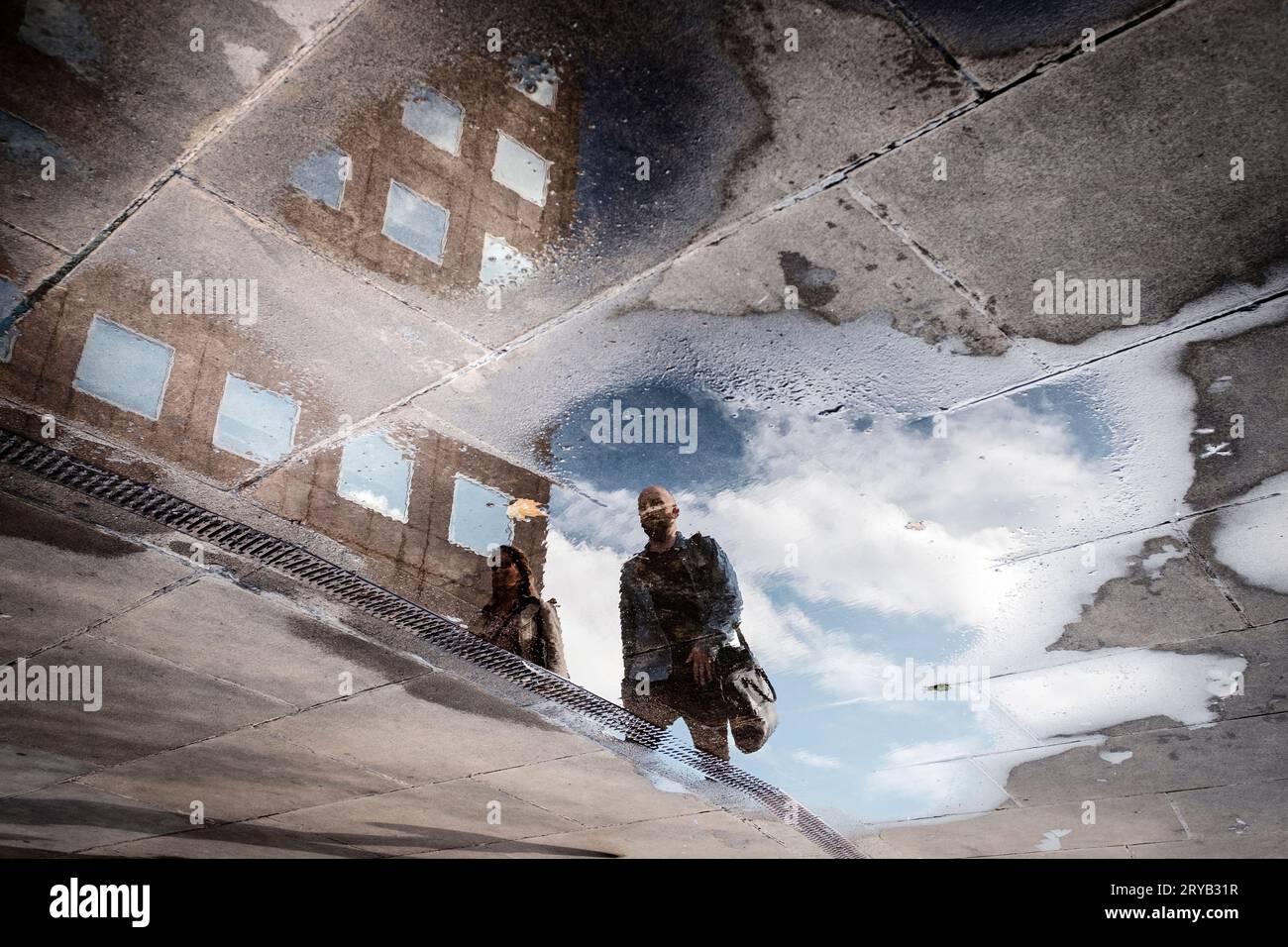 Street photography- man reflection in puddle, London,UK Stock Photo - Alamy