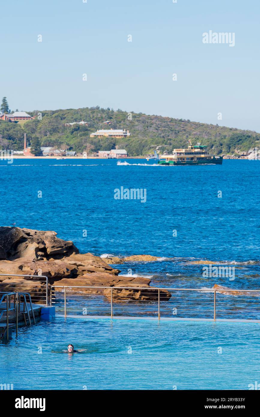 A solitary person swimming in the 1927 opened, Fairlight Beach Rockpool ...