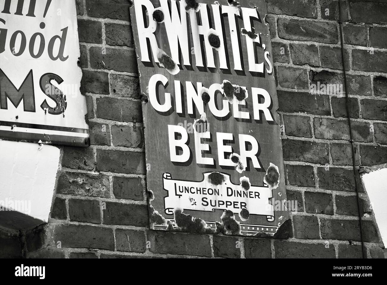 A black and white photograph of a vintage metal sign advertising R ...