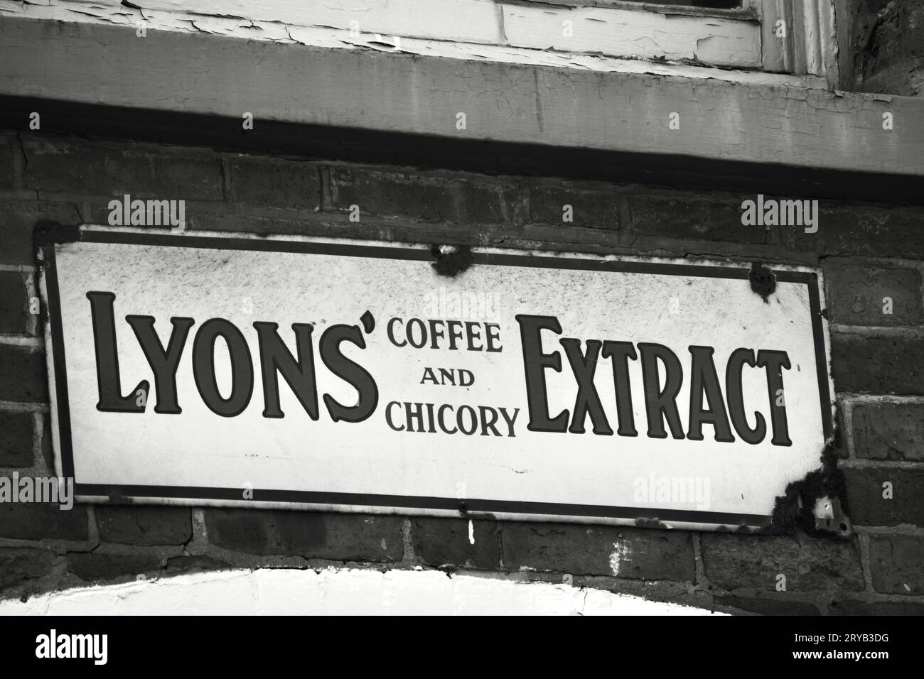A black and white photo of a vintage metal sign advertising Lion's ...