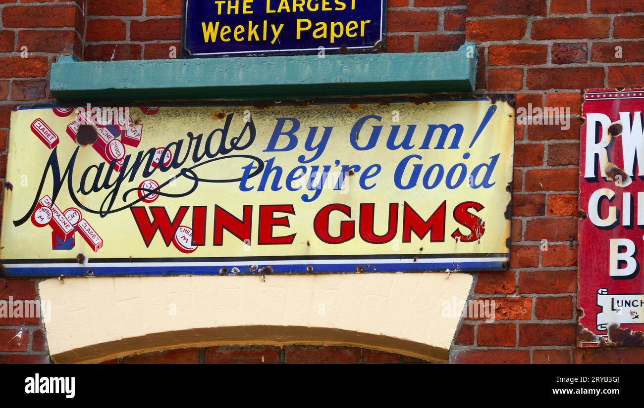 A colour photograph of an old fashioned metal sign advertising Maynards ...