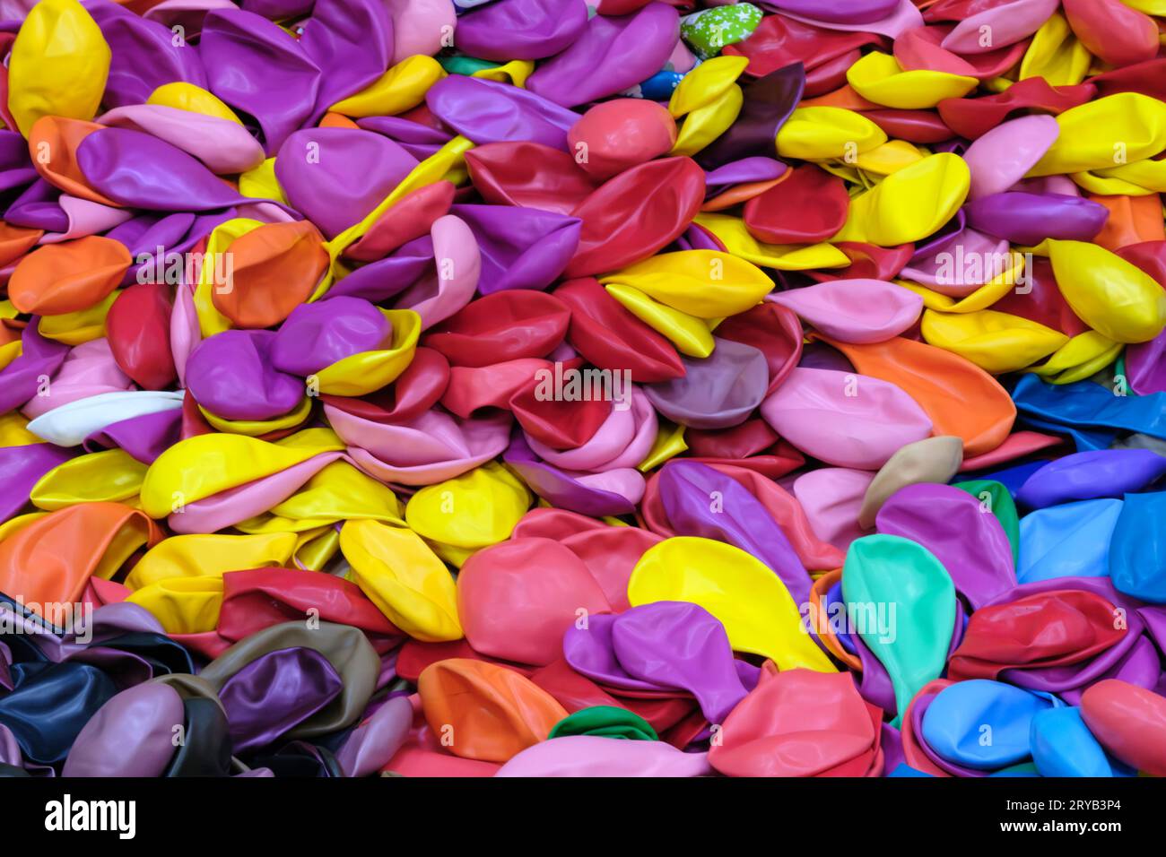 Pile of deflated color pastel balloons. Clean pure baloon template ...