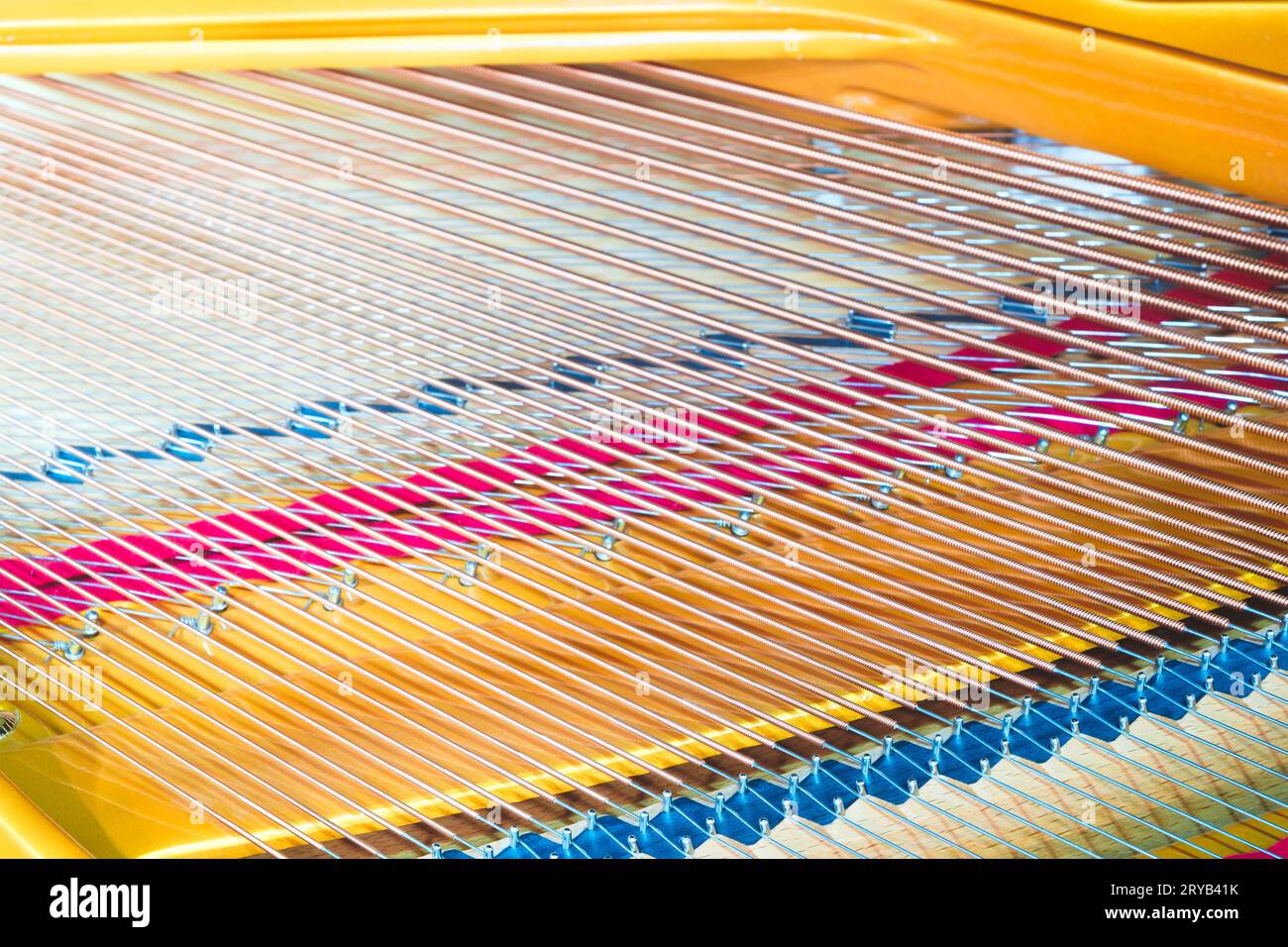 Grand piano strings, steel wire core wound with copper wire Stock Photo ...