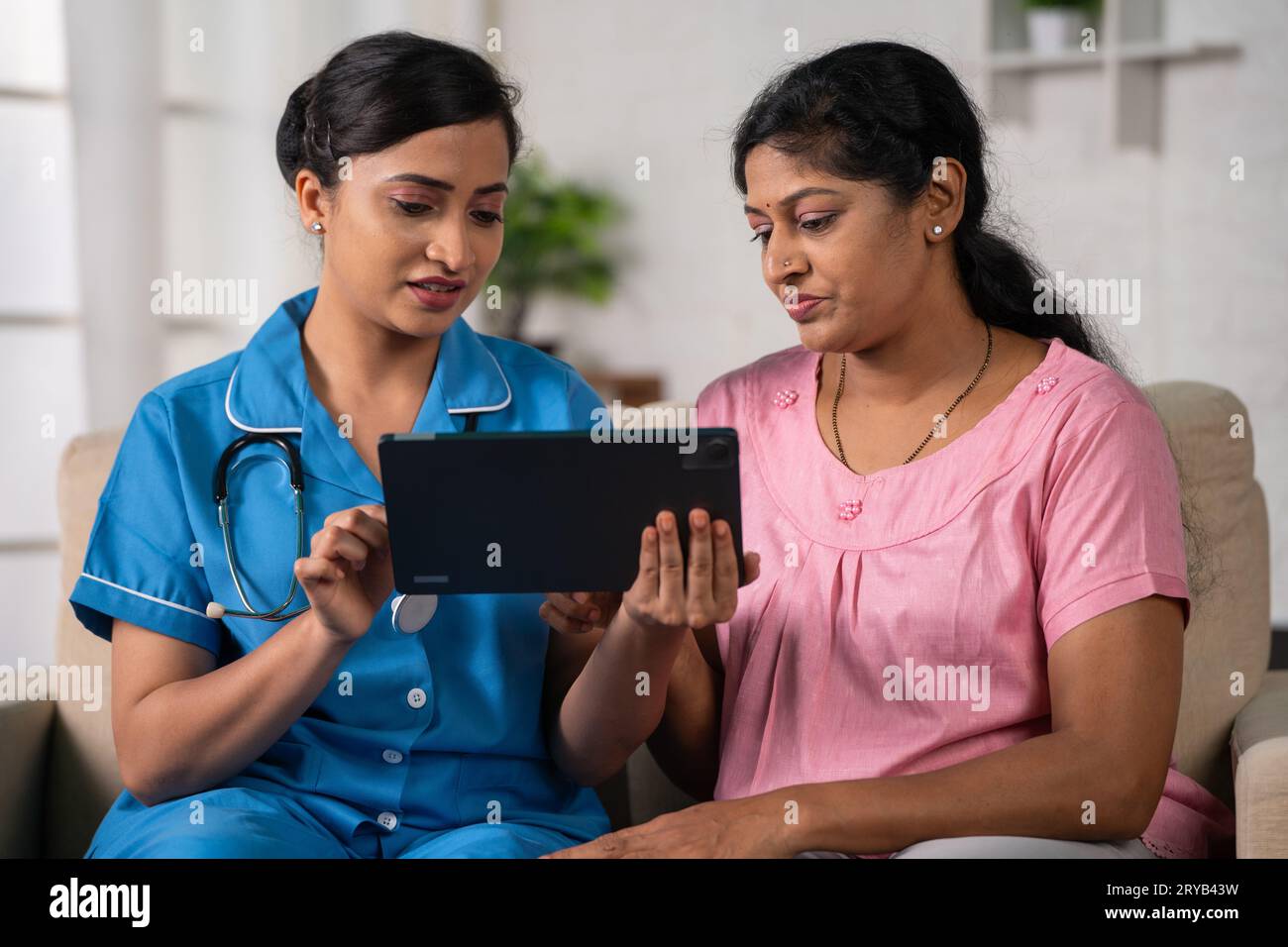Young indian doctor using digital hi-res stock photography and images ...