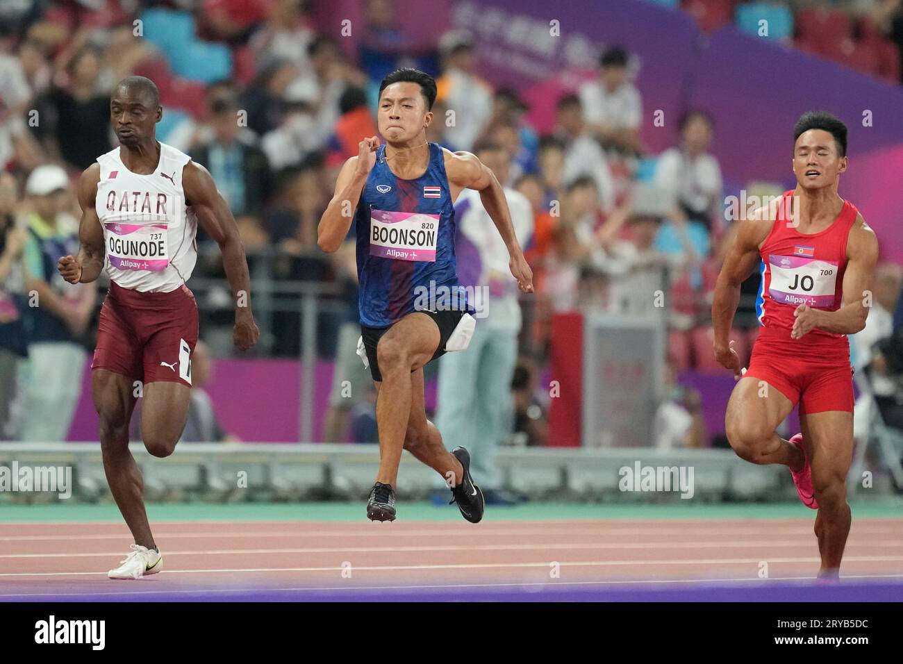Thailand's Puripol Boonson, center, competes with Qatar's Femi Ogunode ...