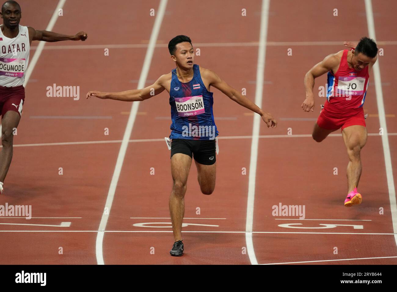 Thailand's Puripol Boonson, center cross the finish line with North ...