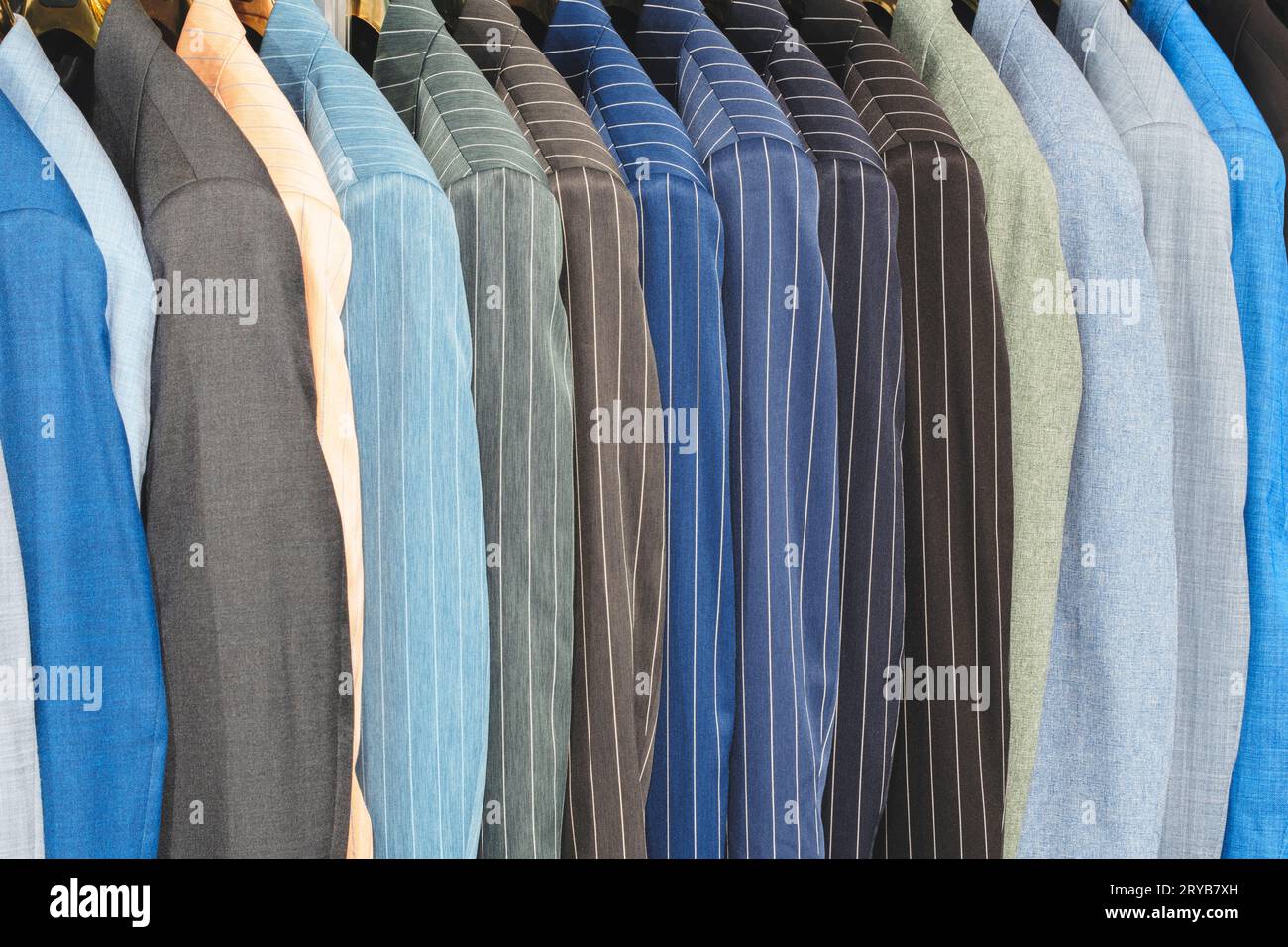 Racks with different men's suits in a men's clothing boutique Stock ...