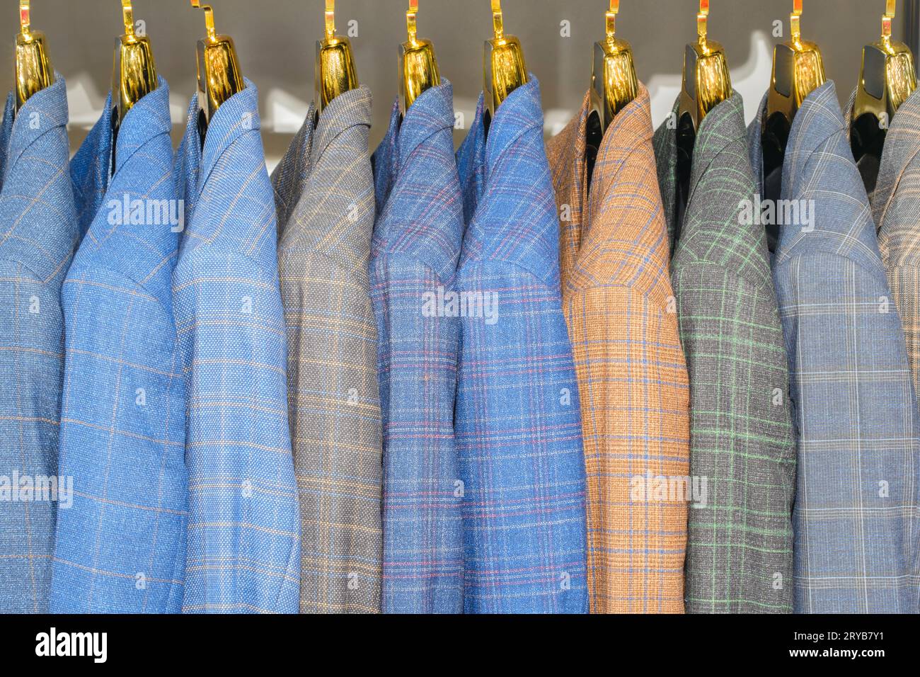 Racks with different men's suits in a men's clothing boutique Stock ...