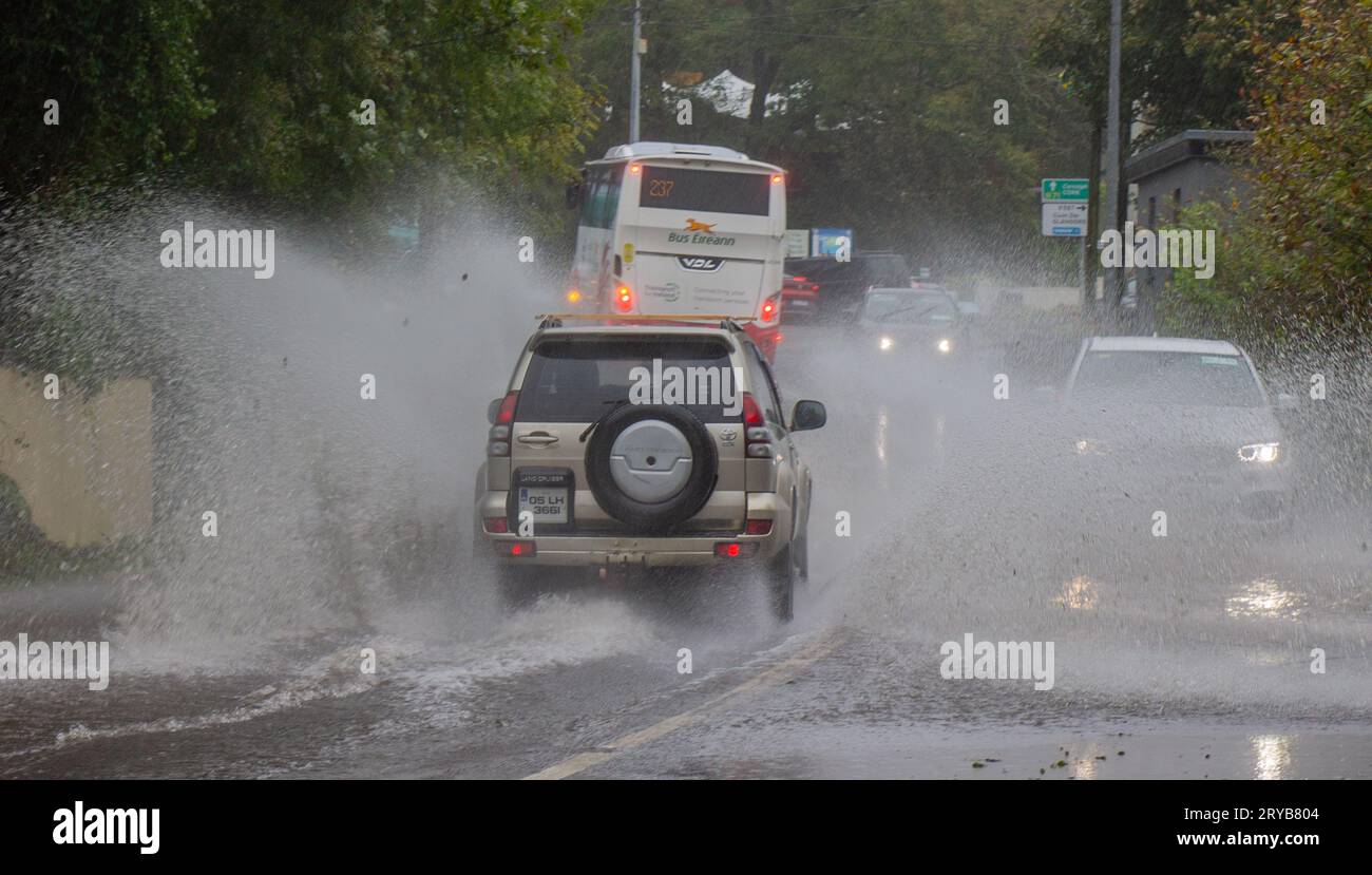 Vehicles driving through flooded roads after heavy rain Winter Storm ...