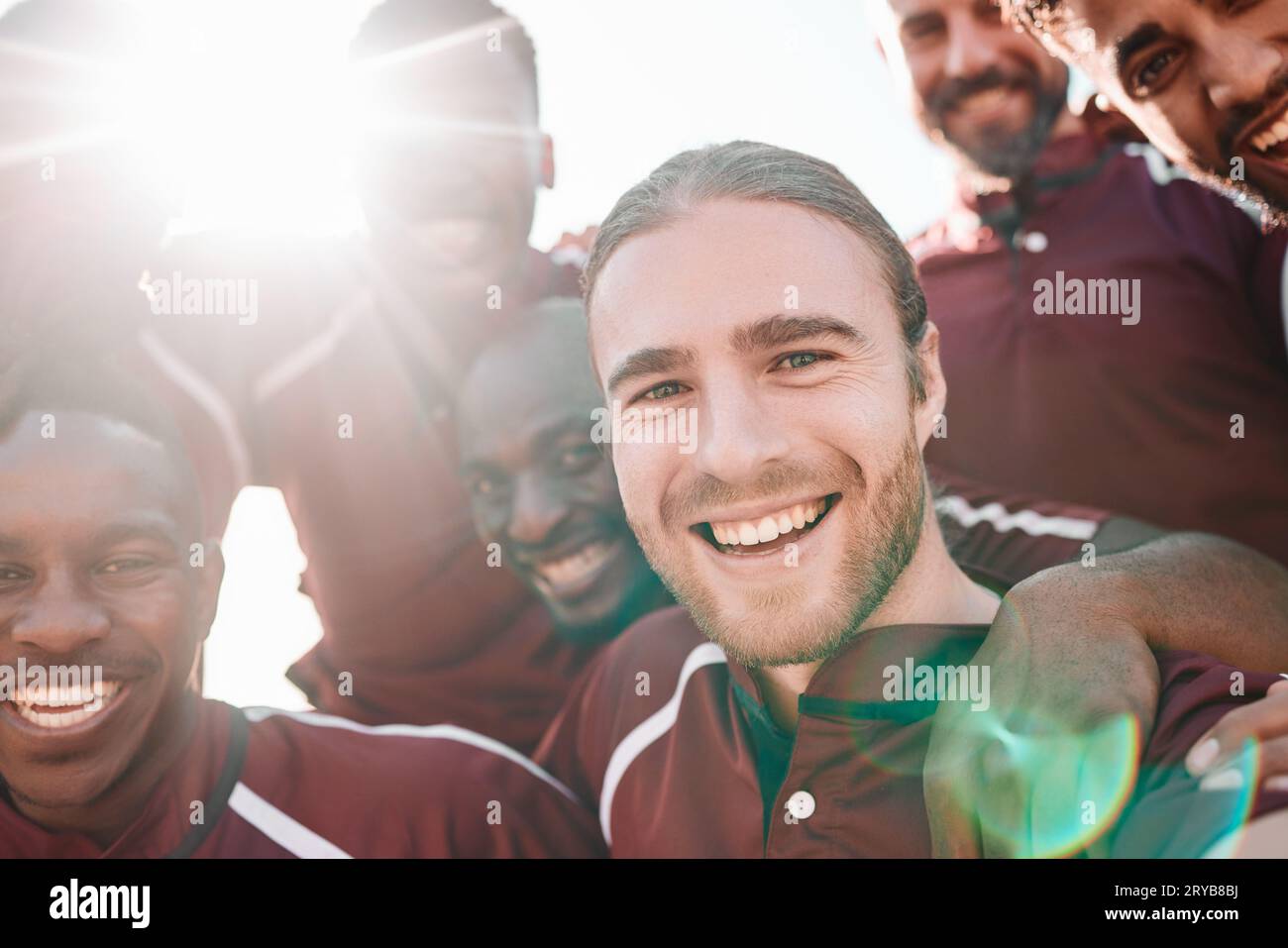 Football team, portrait and happy on sports field with victory, pride ...