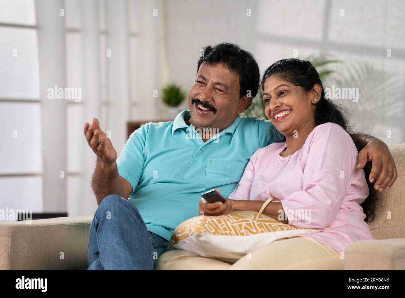 Indian couple watching movie hi-res stock photography and images - Alamy