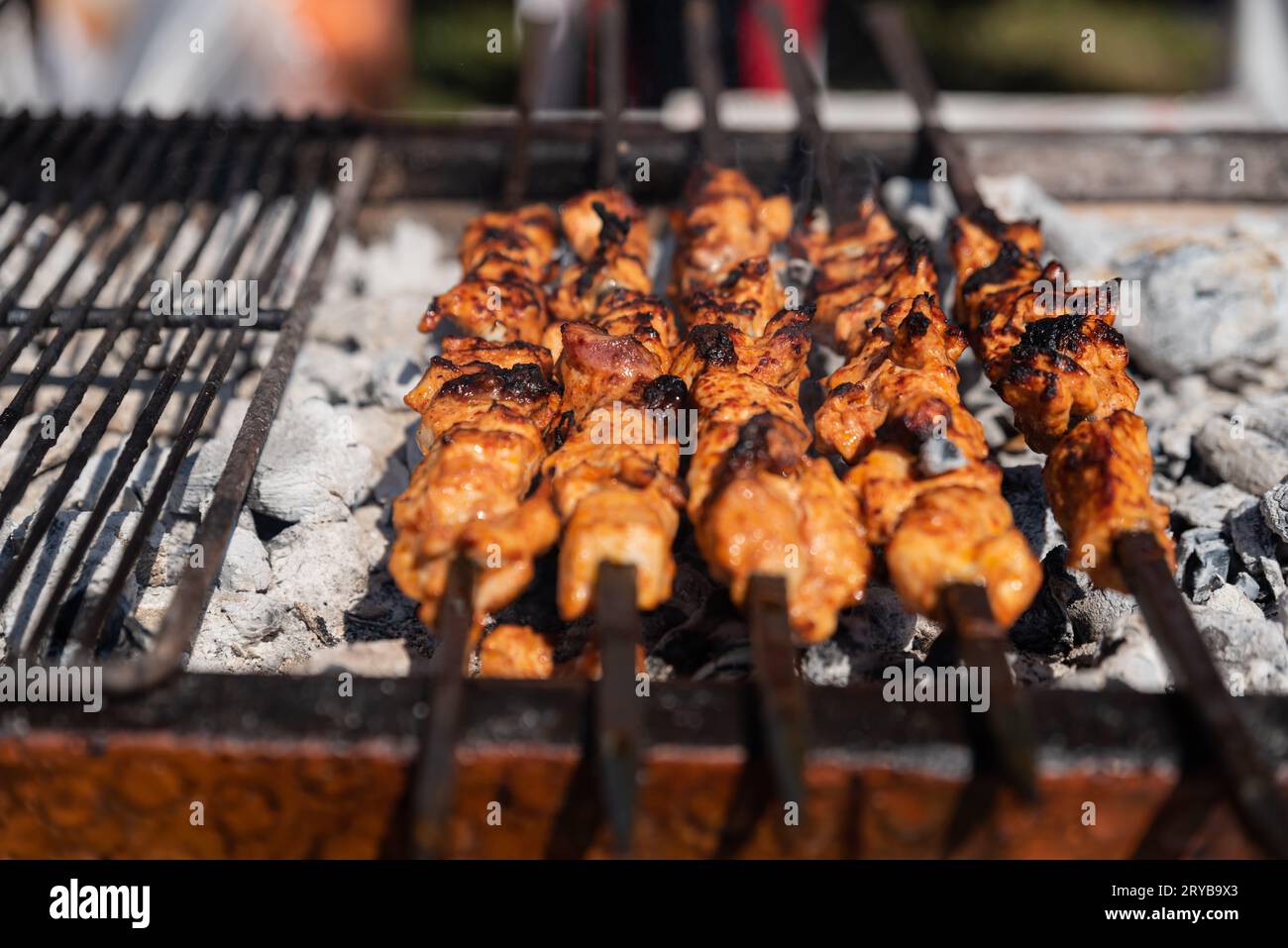 delicious bbq chicken kebab grilling on open grill, outdoor kitchen ...