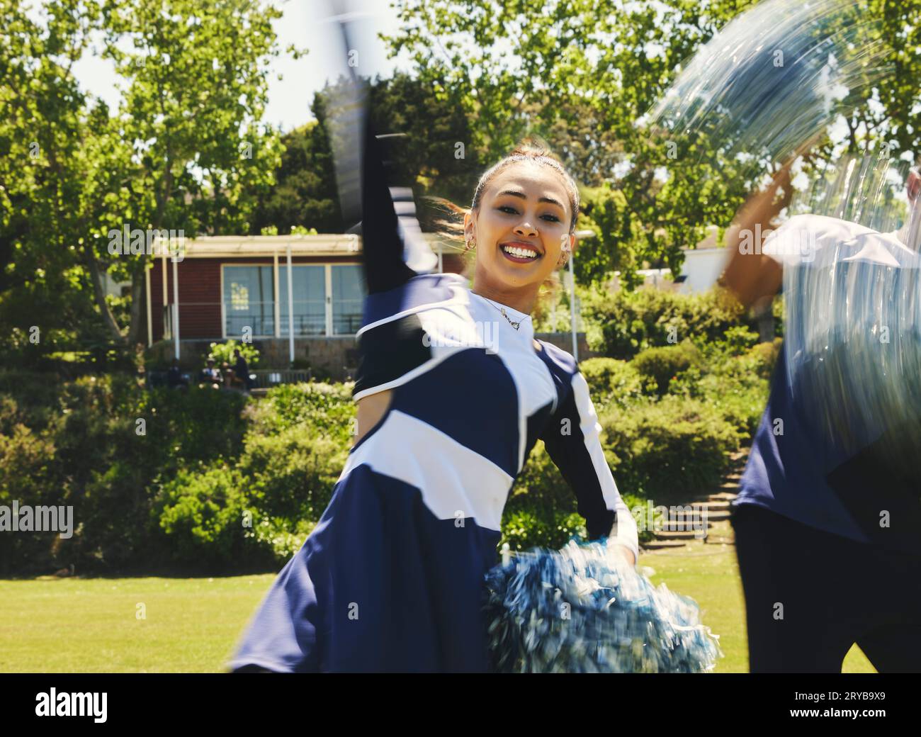Cheerleader, lead dancer and hand raise in routine for university sport ...