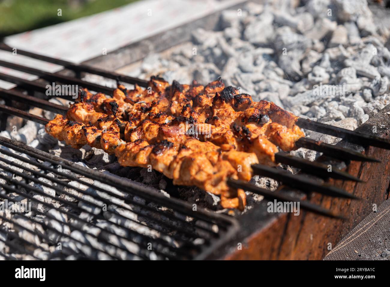 delicious bbq chicken kebab grilling on open grill, outdoor kitchen ...