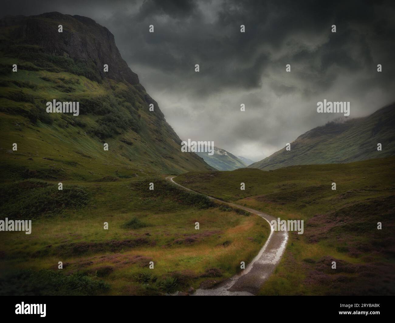 Winding road in the middle of scottish highlands Stock Photo - Alamy